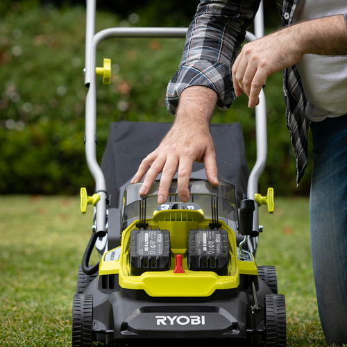 Ryobi cordless lawn mower with battery and charger store